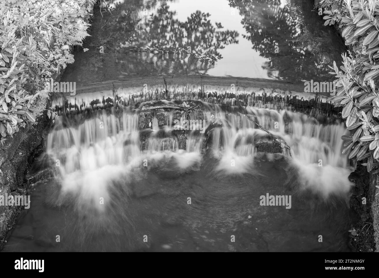 Long exposure of a waterfall flowing through Buxton Pavilion Gardens in ...