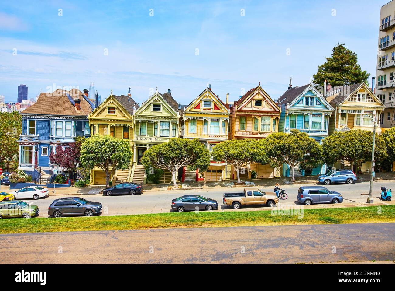 Seven houses of varying colors as The Painted Ladies on cloudy summer ...