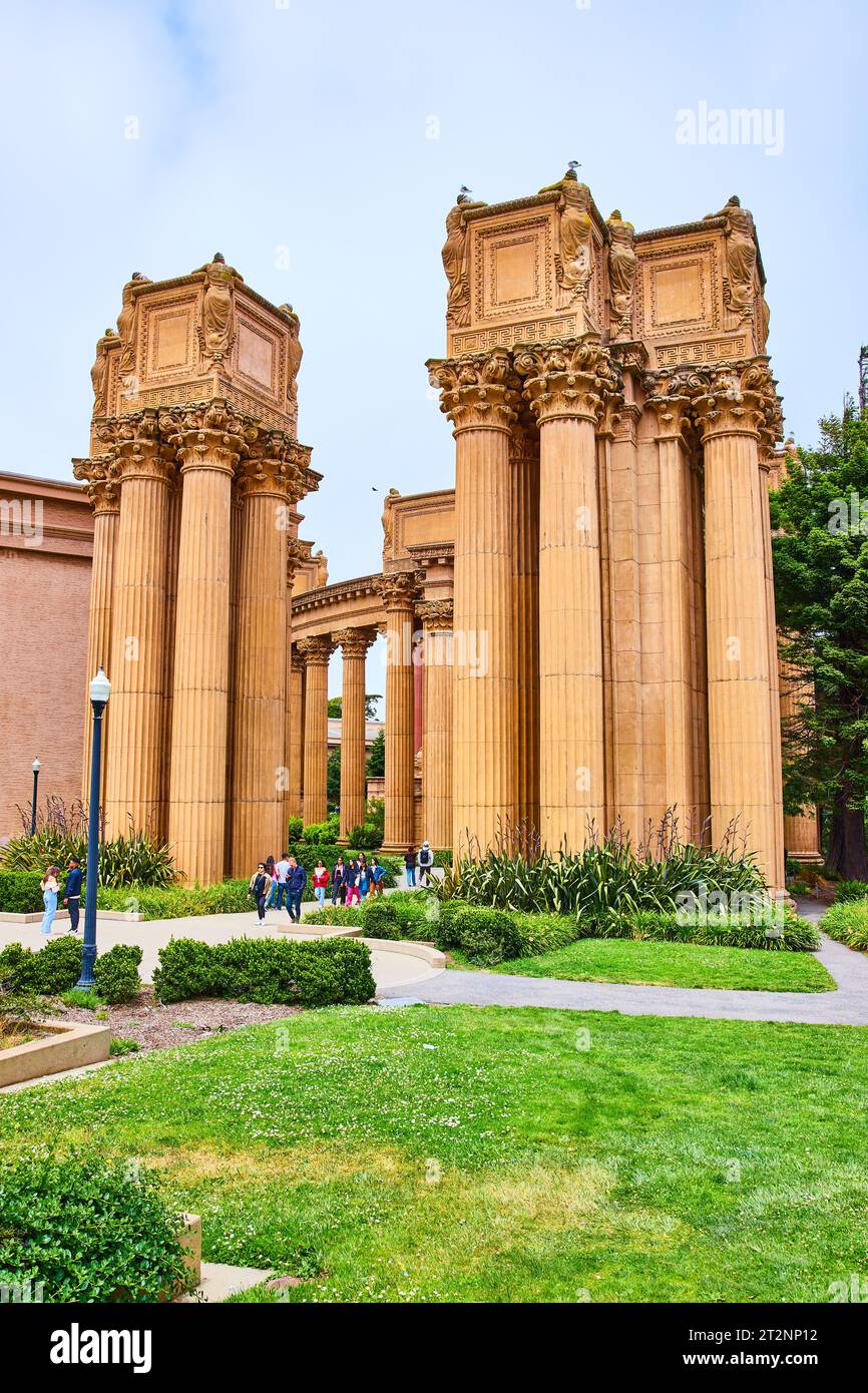 Roman colonnade pillars with people walking between them on trail at ...