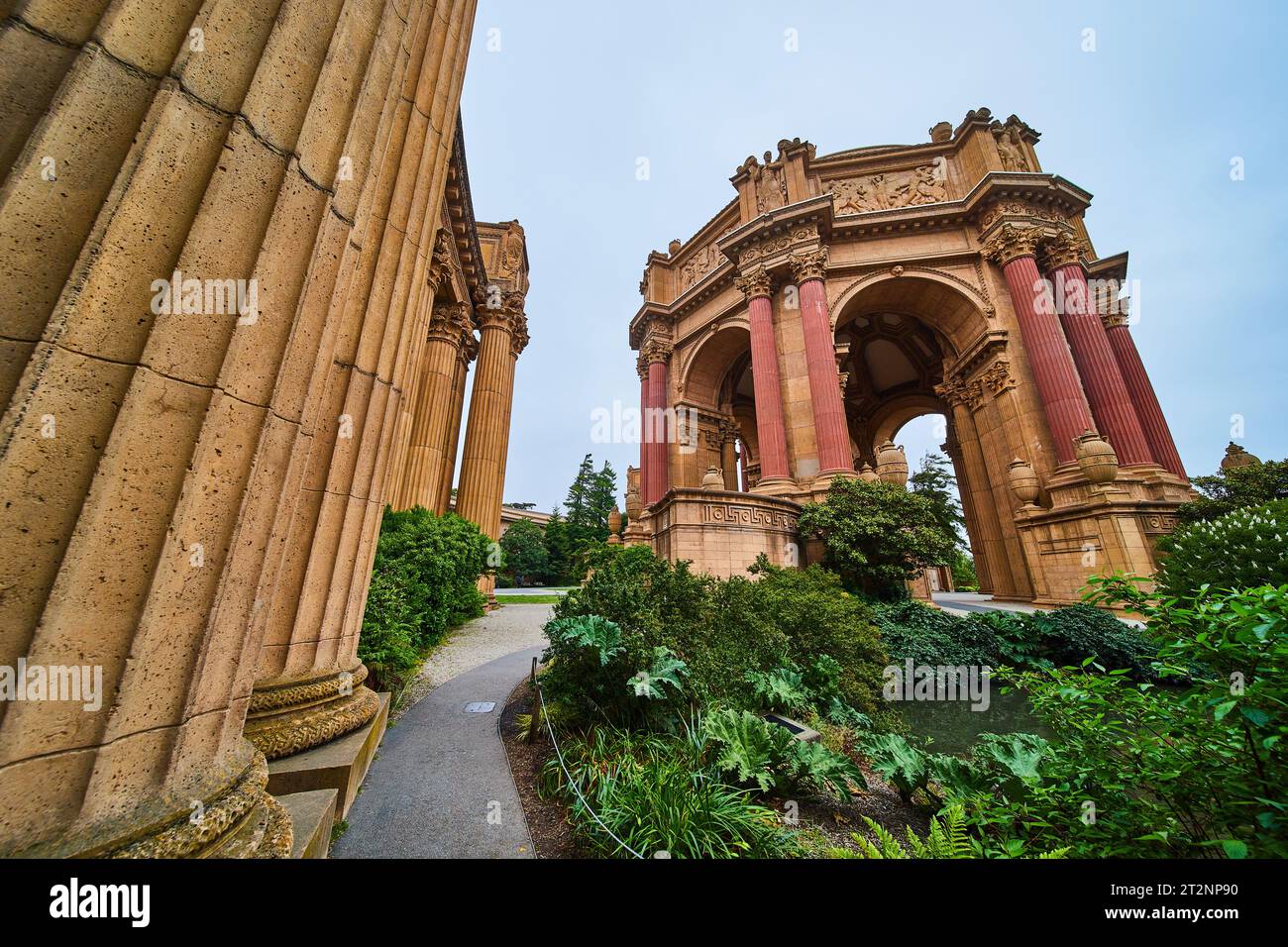Path between colonnade and open air rotunda at Palace of Fine Arts with ...
