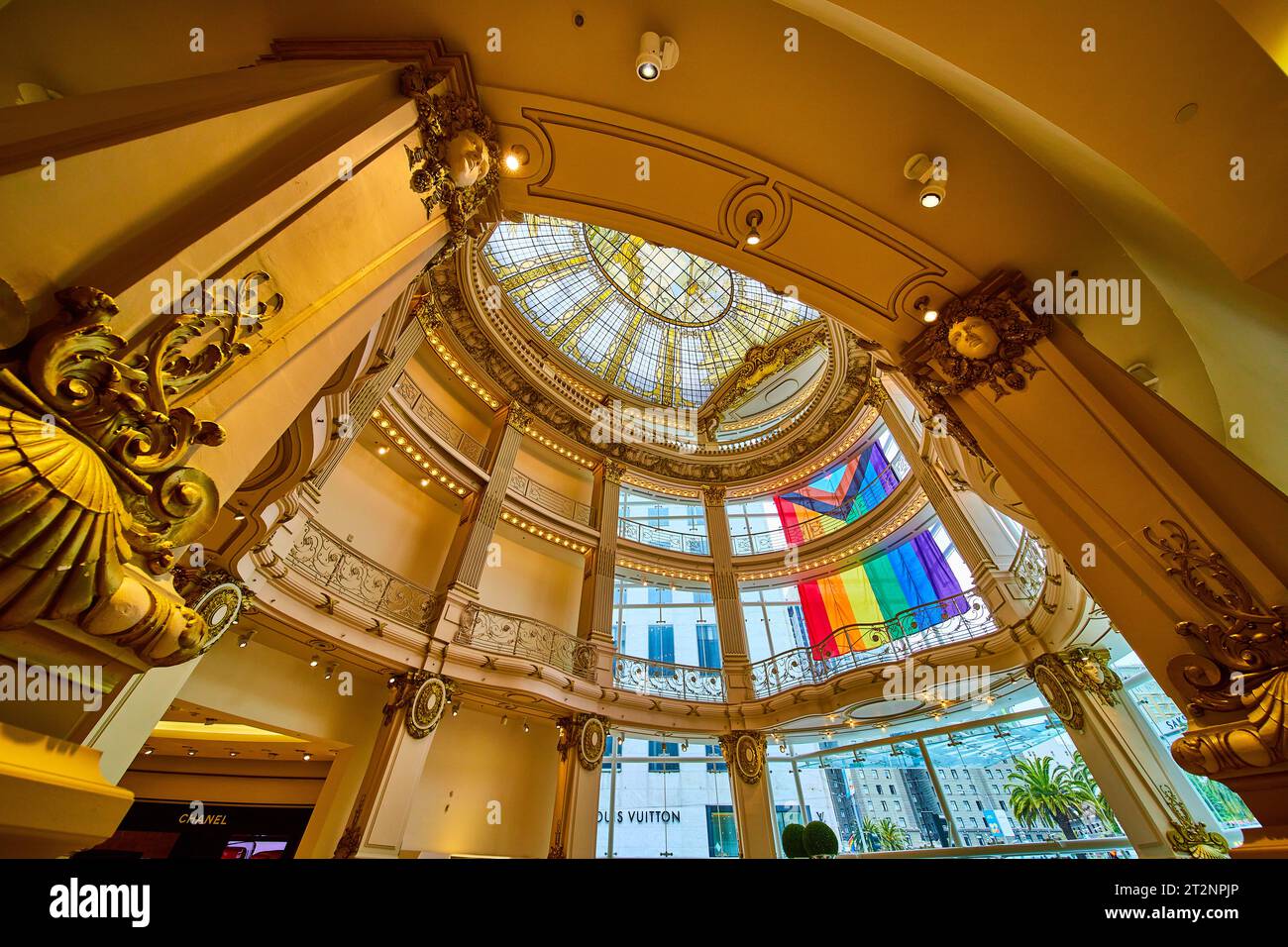 Fancy golden pillars framing interior view of Rotunda with ceiling and ...