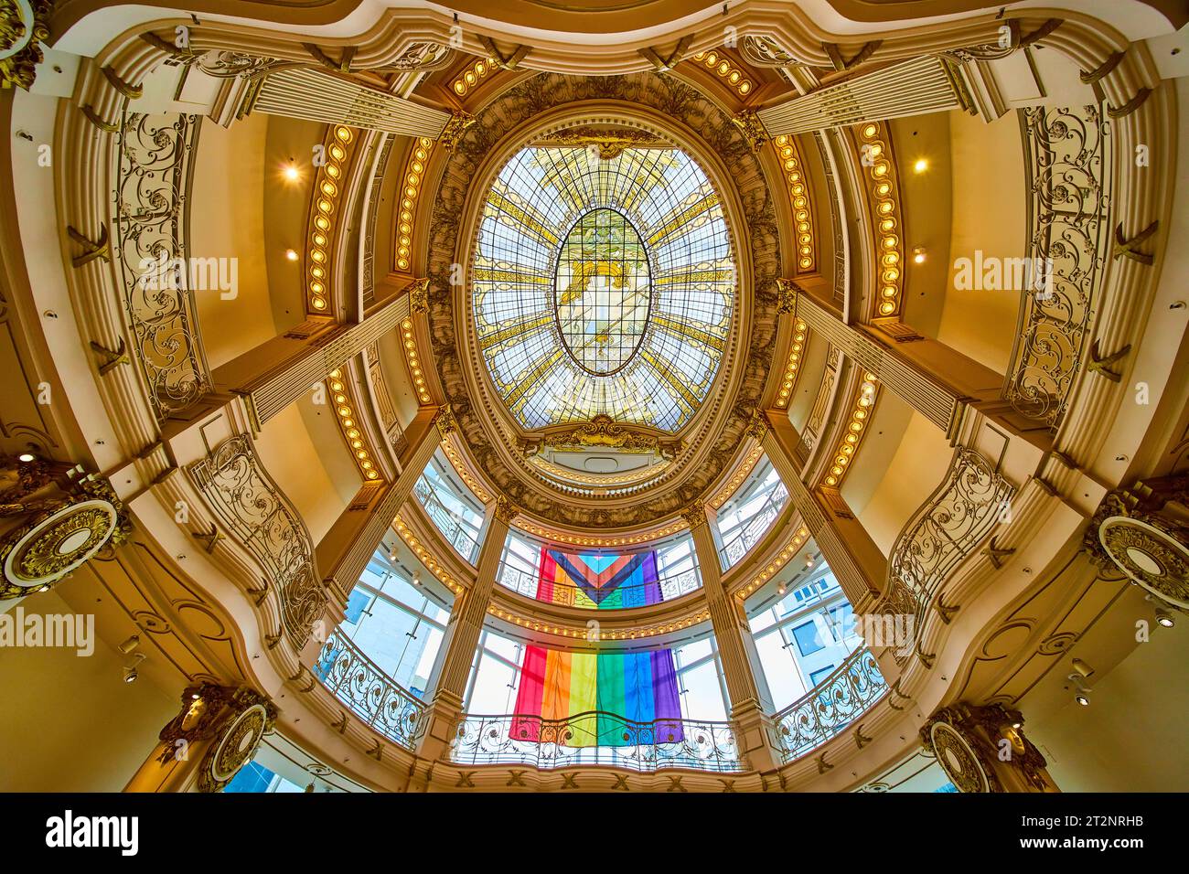 Upward view of fancy golden building with stained glass window and ...