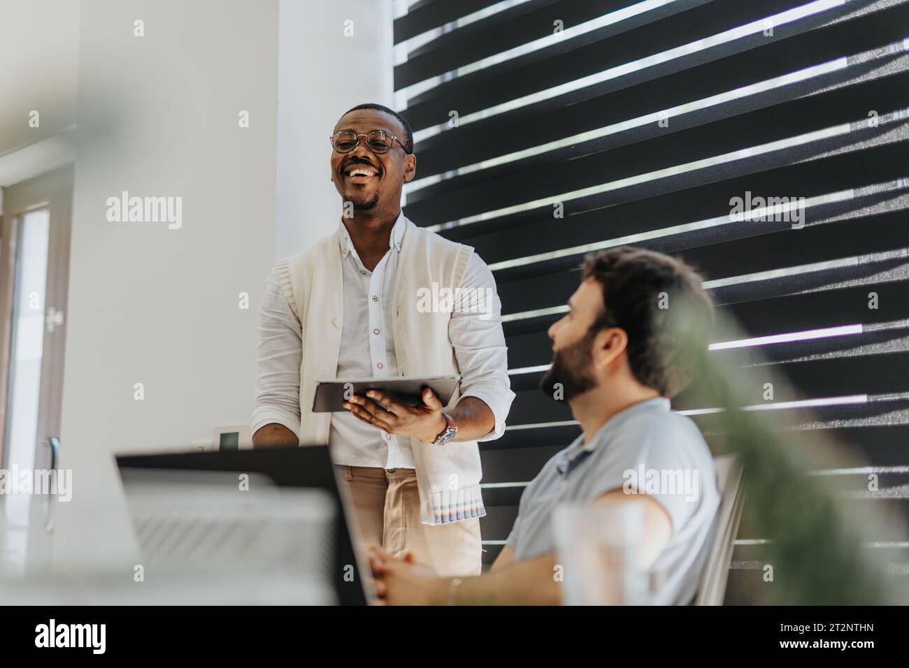 Happy teammates working together in a positive atmosphere at the office ...