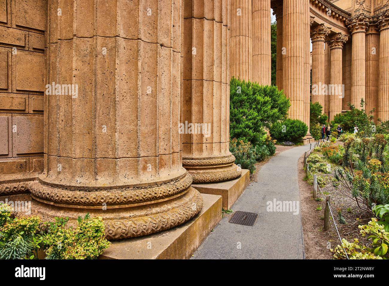 People walking on trail beside Ancient Roman styled colonnade Stock ...
