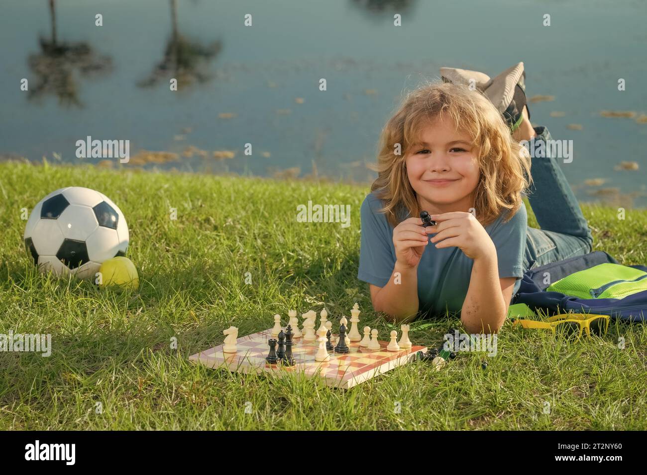 Dream kids and childhood concept. Chess game for children. Kid playing ...
