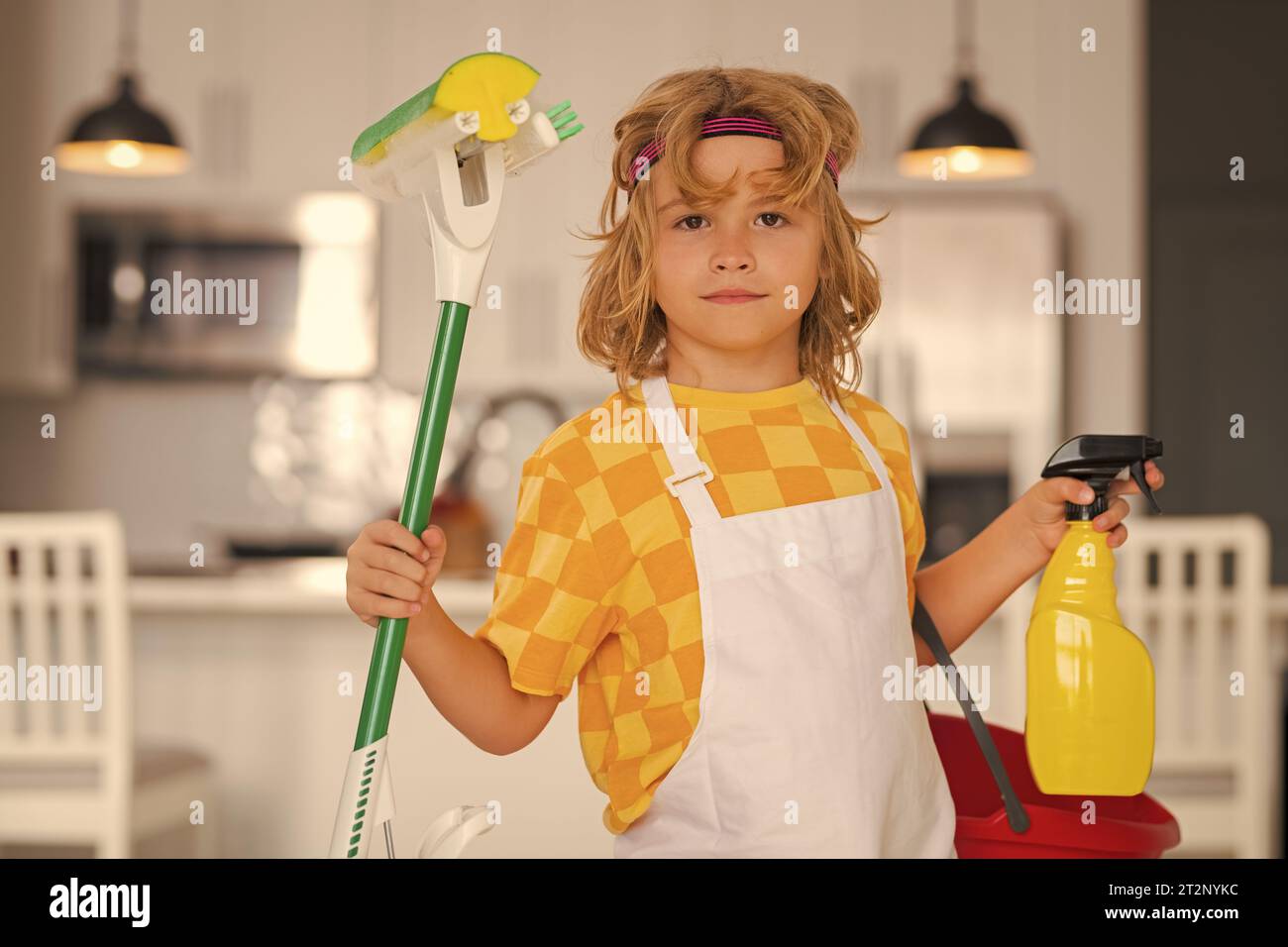 Children helping with housekeeping, cleaning the house. Housekeeping at ...