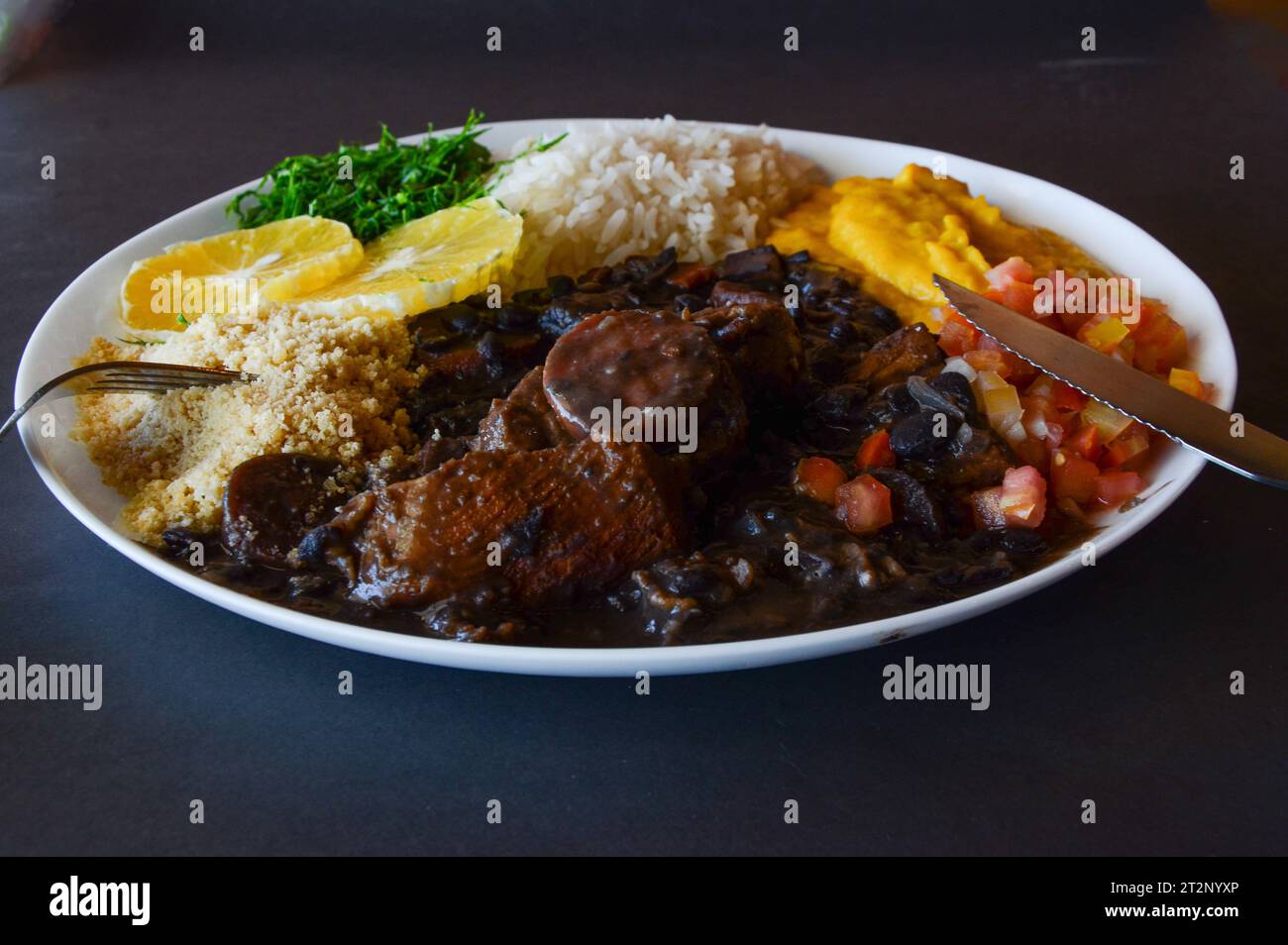 a traditional feijoada dish, with beans, Calabrese sausage and paio ...