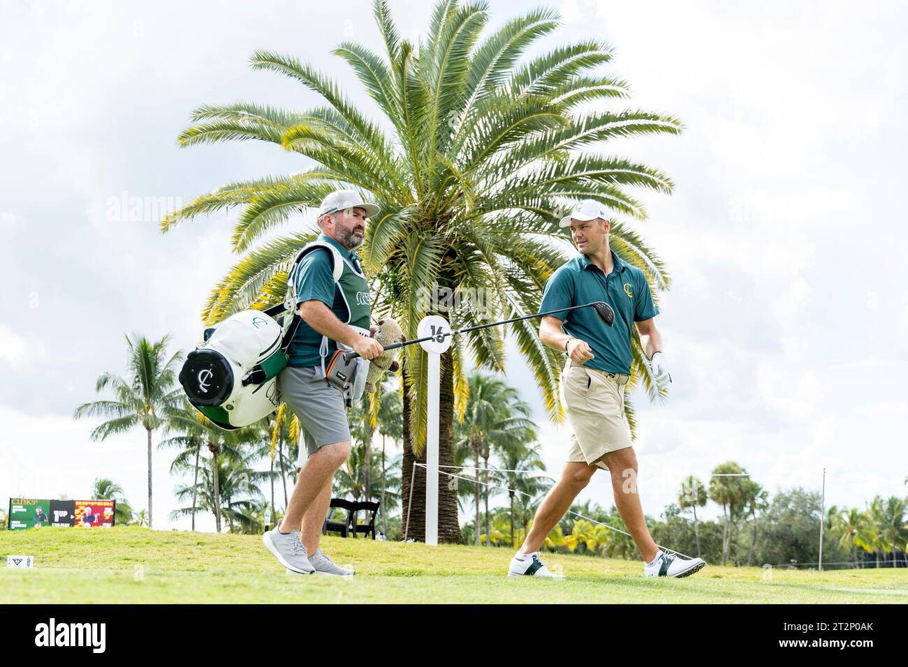 Captain Martin Kaymer of Cleeks GC and his caddie, Craig Connelly, walk ...