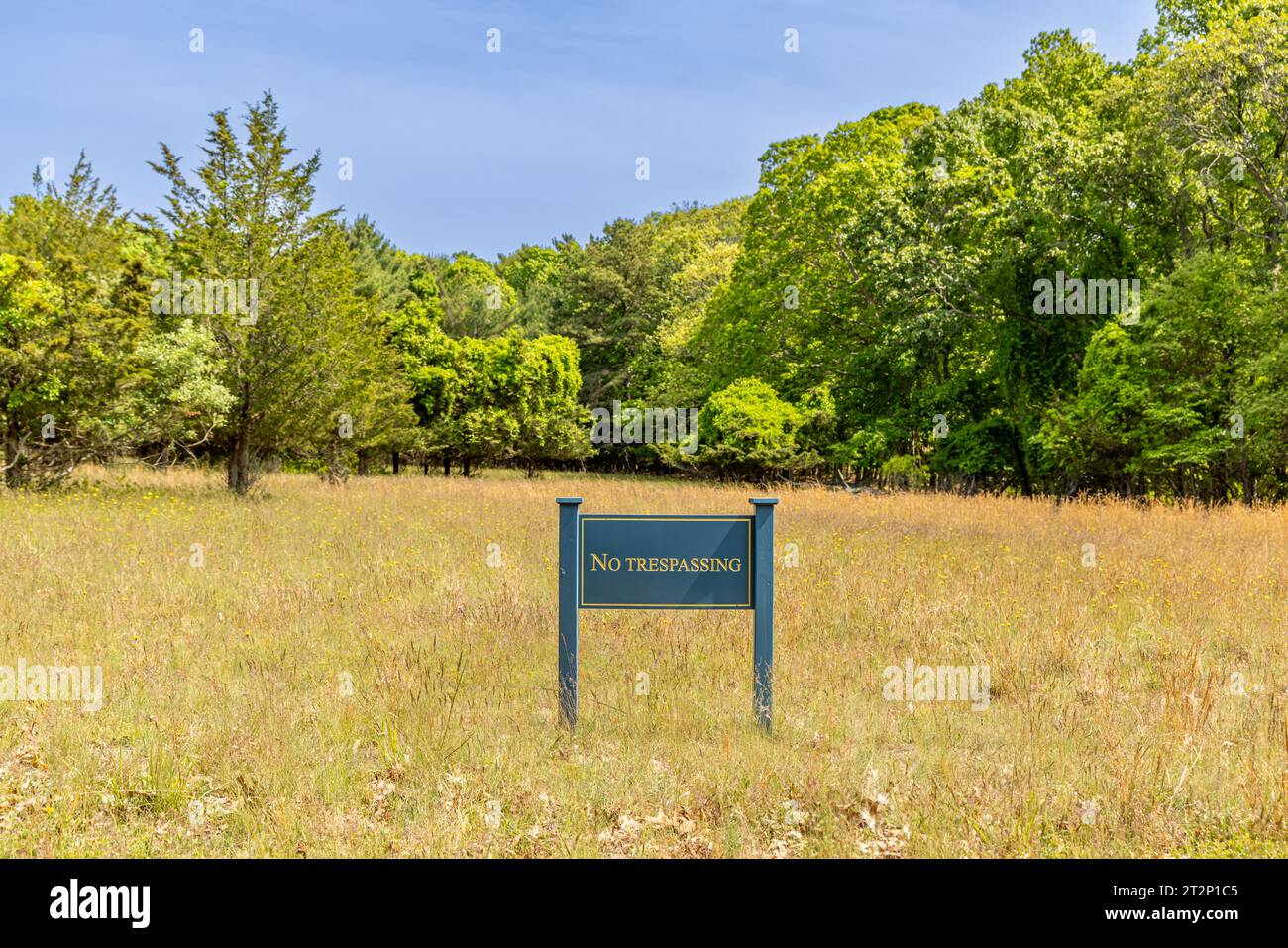 nice no trespassing sign in a field in east hampton, ny Stock Photo - Alamy