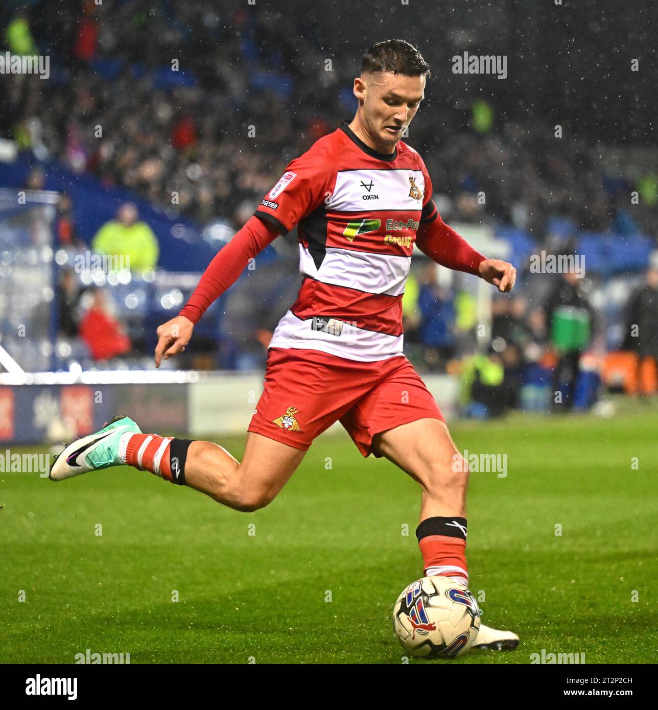 Luke Molyneux 7# of Doncaster Rovers Football Club crosses the ball ...