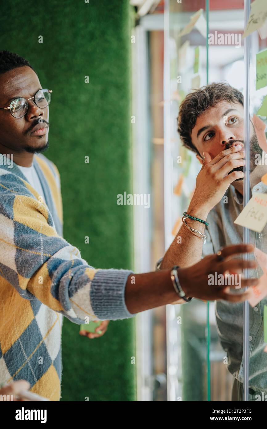 Multi-Generational Business Team Brainstorming and Sharing Ideas in ...