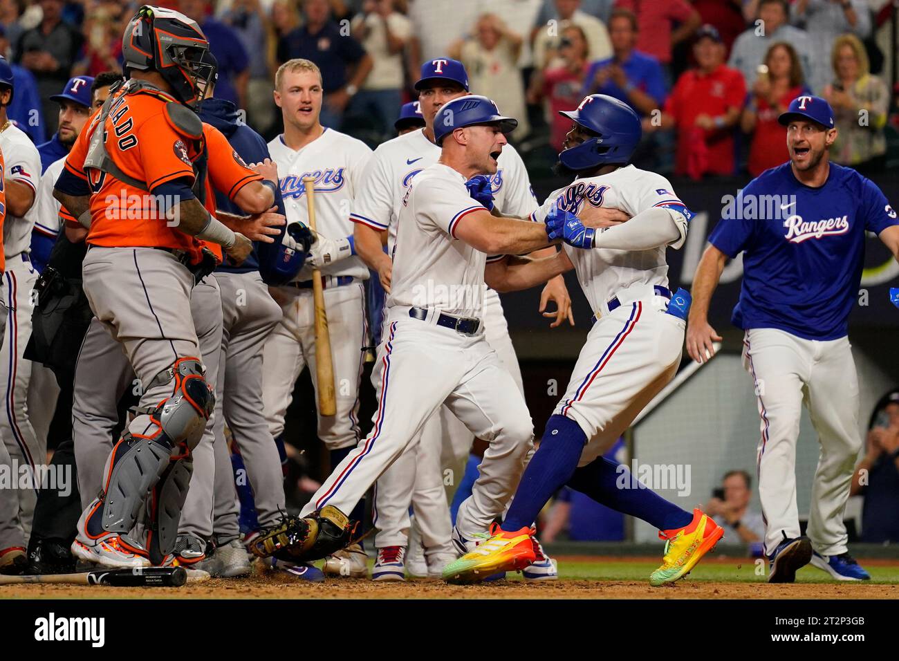 Texas Rangers' Corey Ragsdale, center, restrains Adolis Garcia, right ...