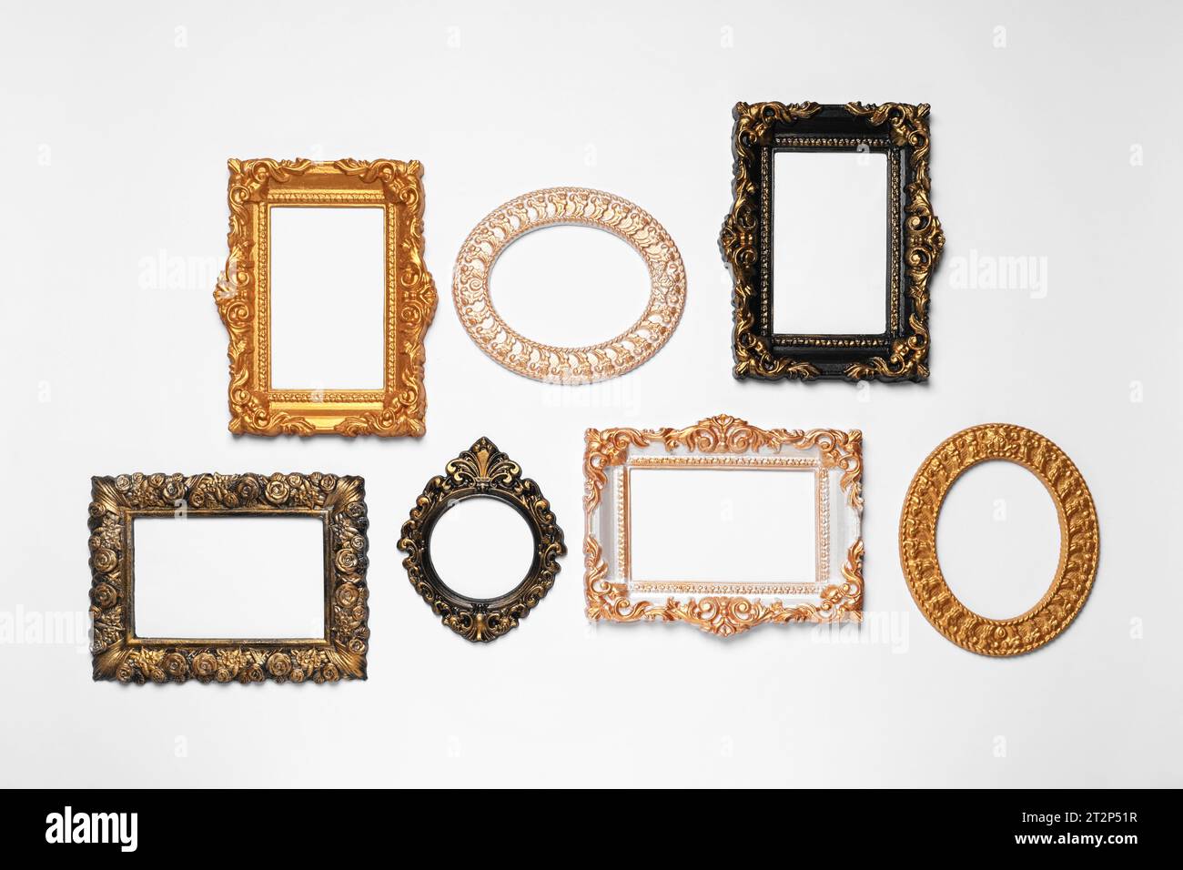 Empty vintage frames hanging on white wall Stock Photo - Alamy