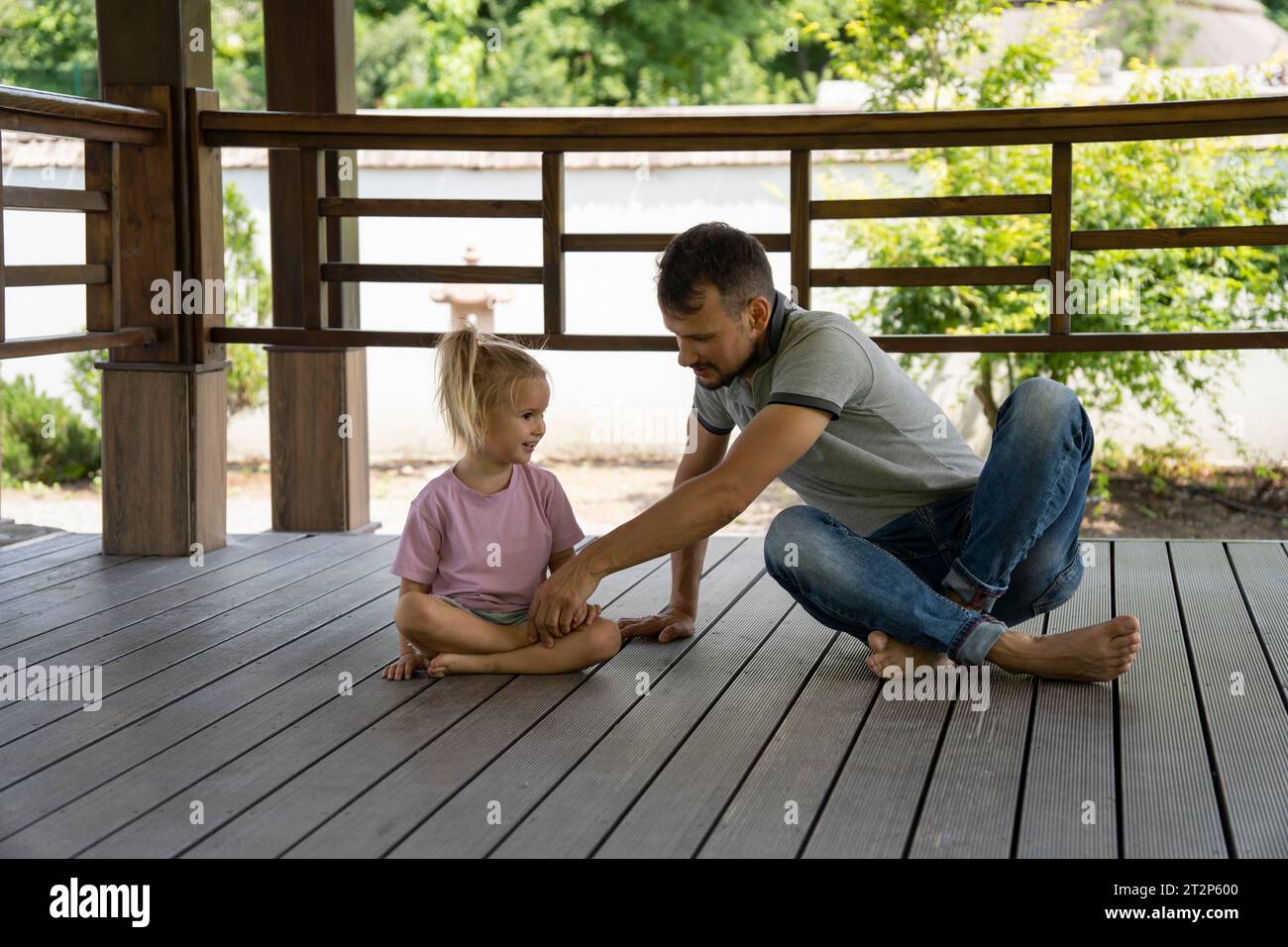 Father learning his daughter to meditate at nature Stock Photo - Alamy