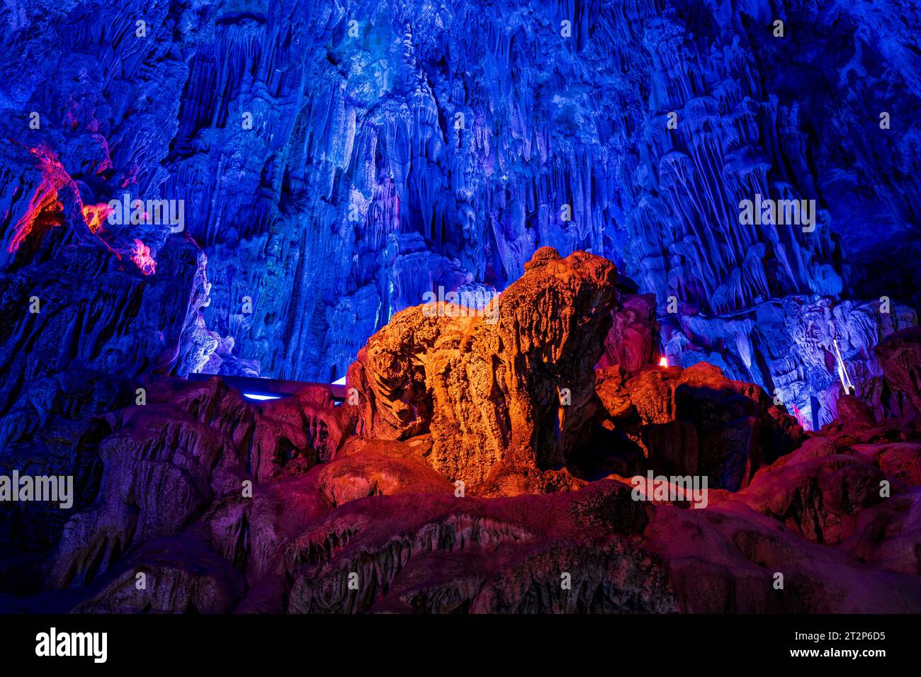 GUILIN, CHINA - SEPTEMBER 27, 2023 - Tourists walk through a cave to ...
