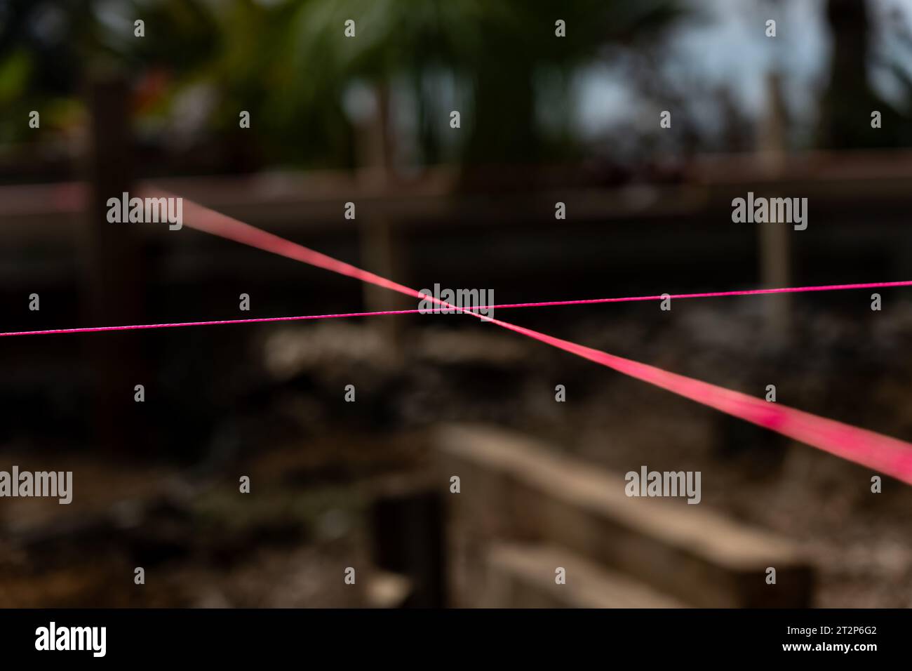 Pink builders string-line closeup on constructions site in selective ...