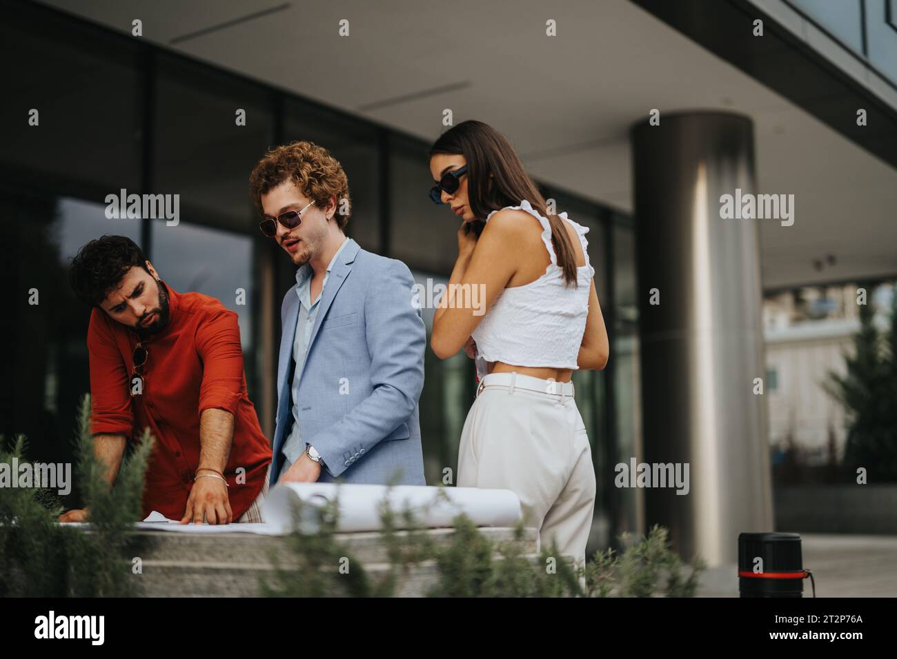 Innovative Collaboration: Architects Discussing Blueprint Outdoors ...