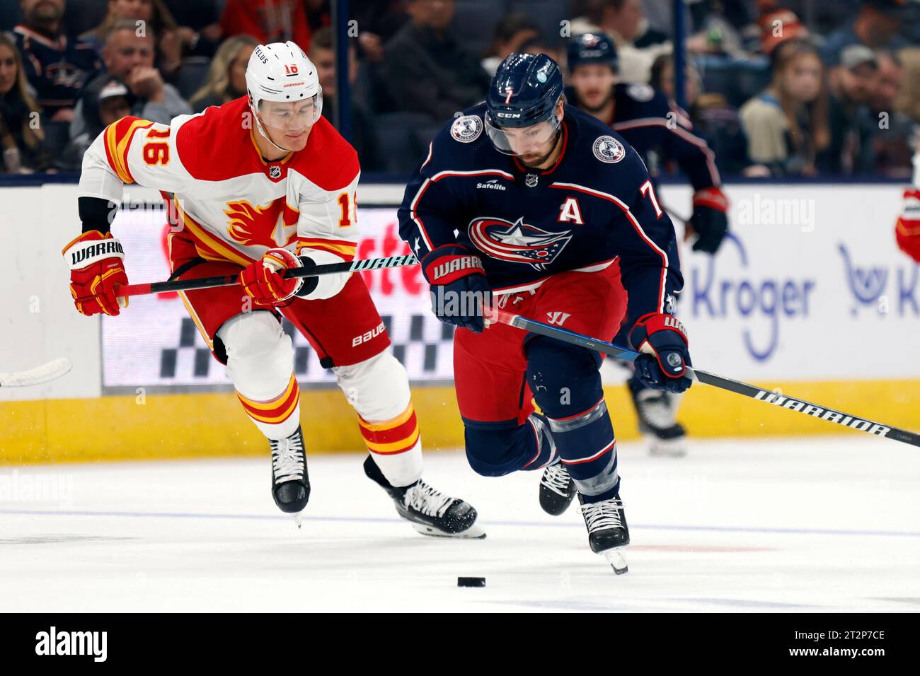 Columbus Blue Jackets forward Sean Kuraly, right, chases the puck in ...