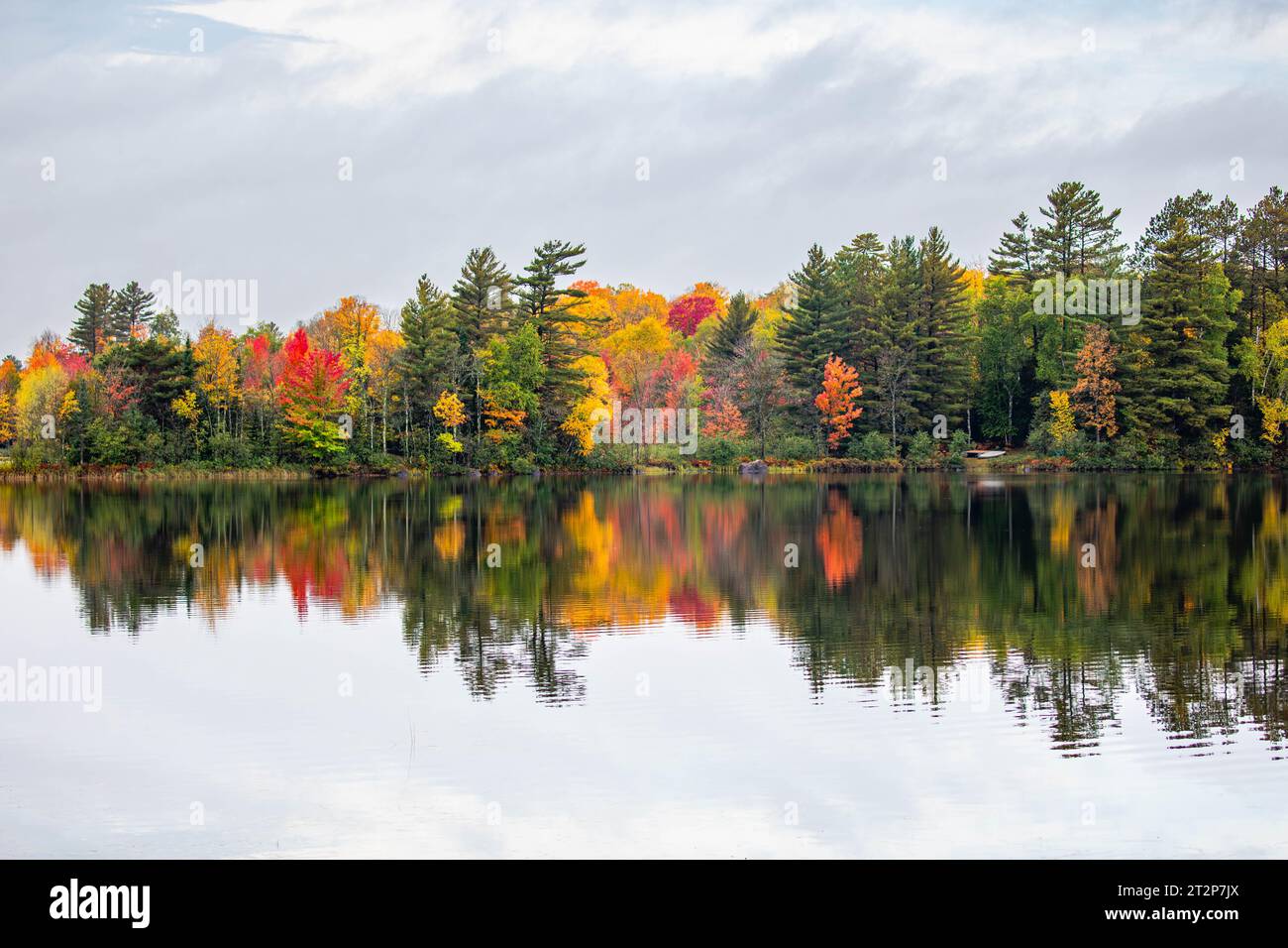 Colorful autumn trees on lake of the Falls in Mercer, Wisconsin ...