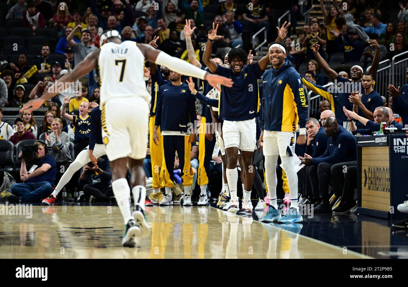The Indiana Pacers bench celebrates after a 3-point basket made by ...