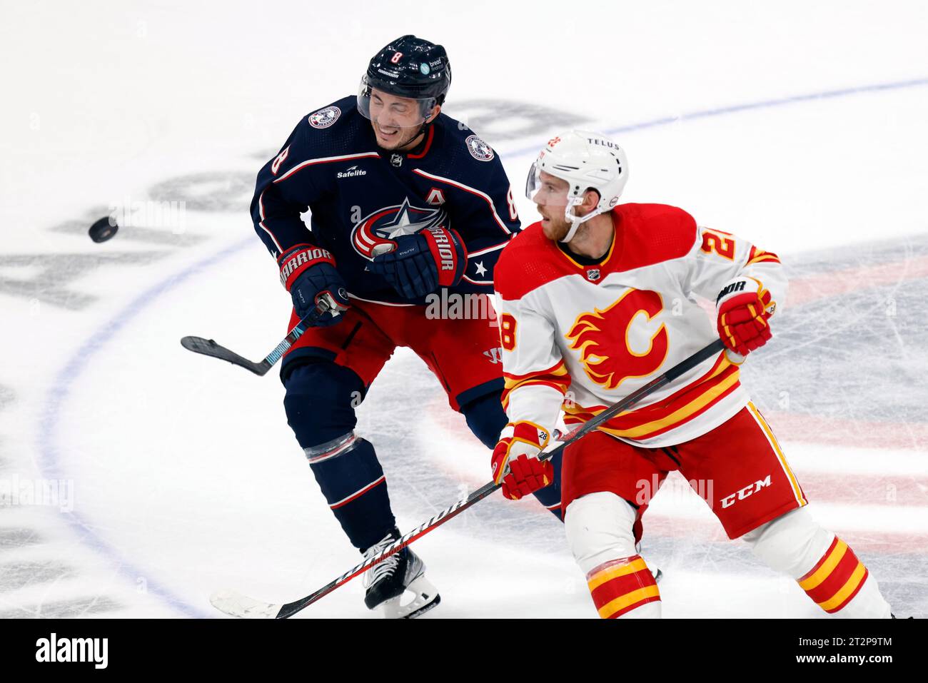 Columbus Blue Jackets defenseman Zach Werenski, left, and Calgary ...