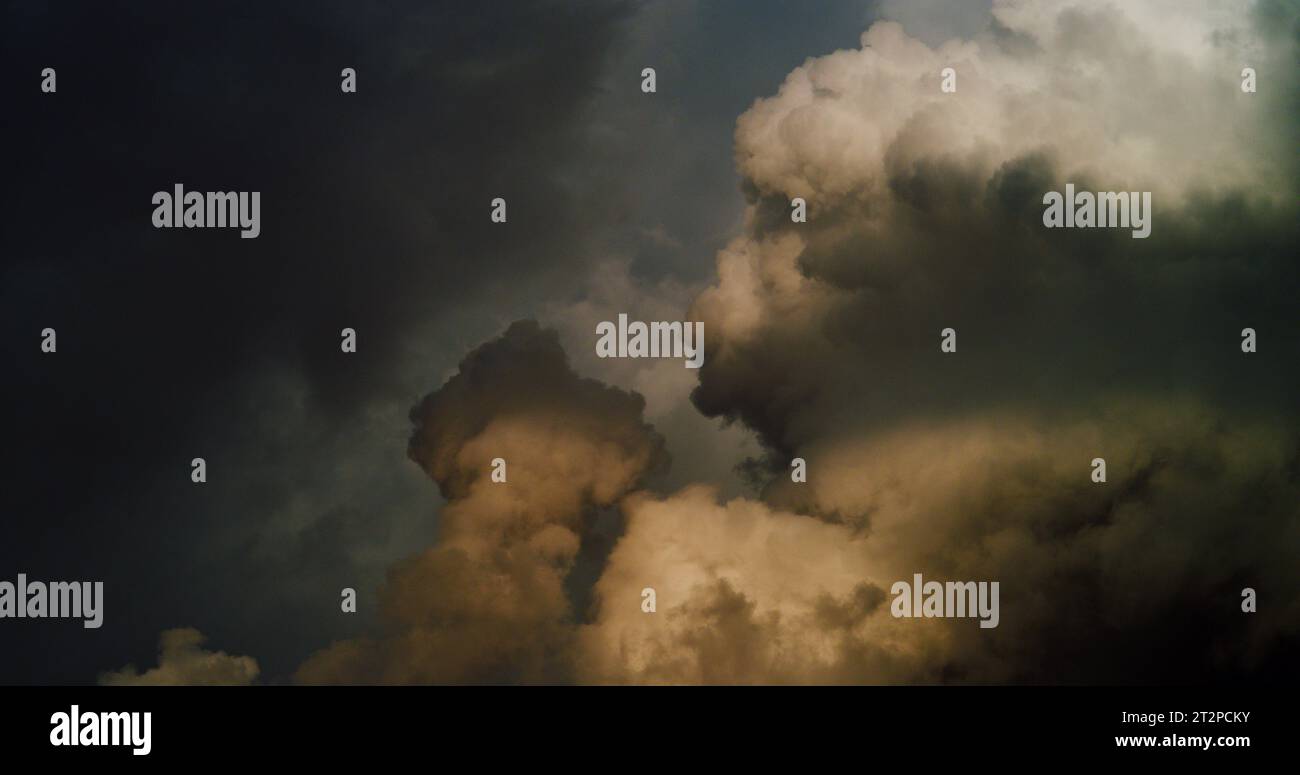 Evening storm clouds burst with impressionistic light, texture, and ...