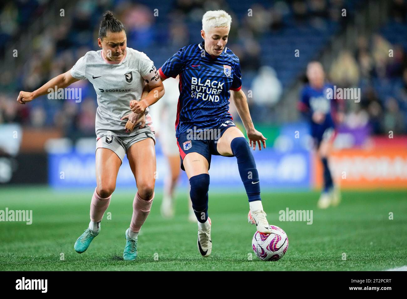 OL Reign forward Megan Rapinoe, right, moves the ball against Angel ...
