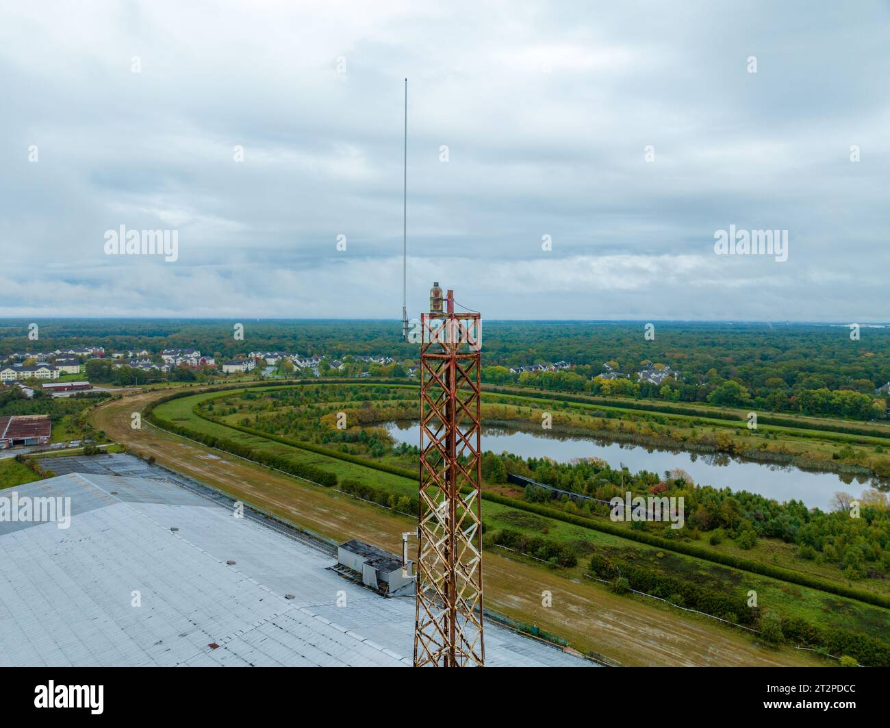Old television and radio tower in faded colors with rusty structural ...