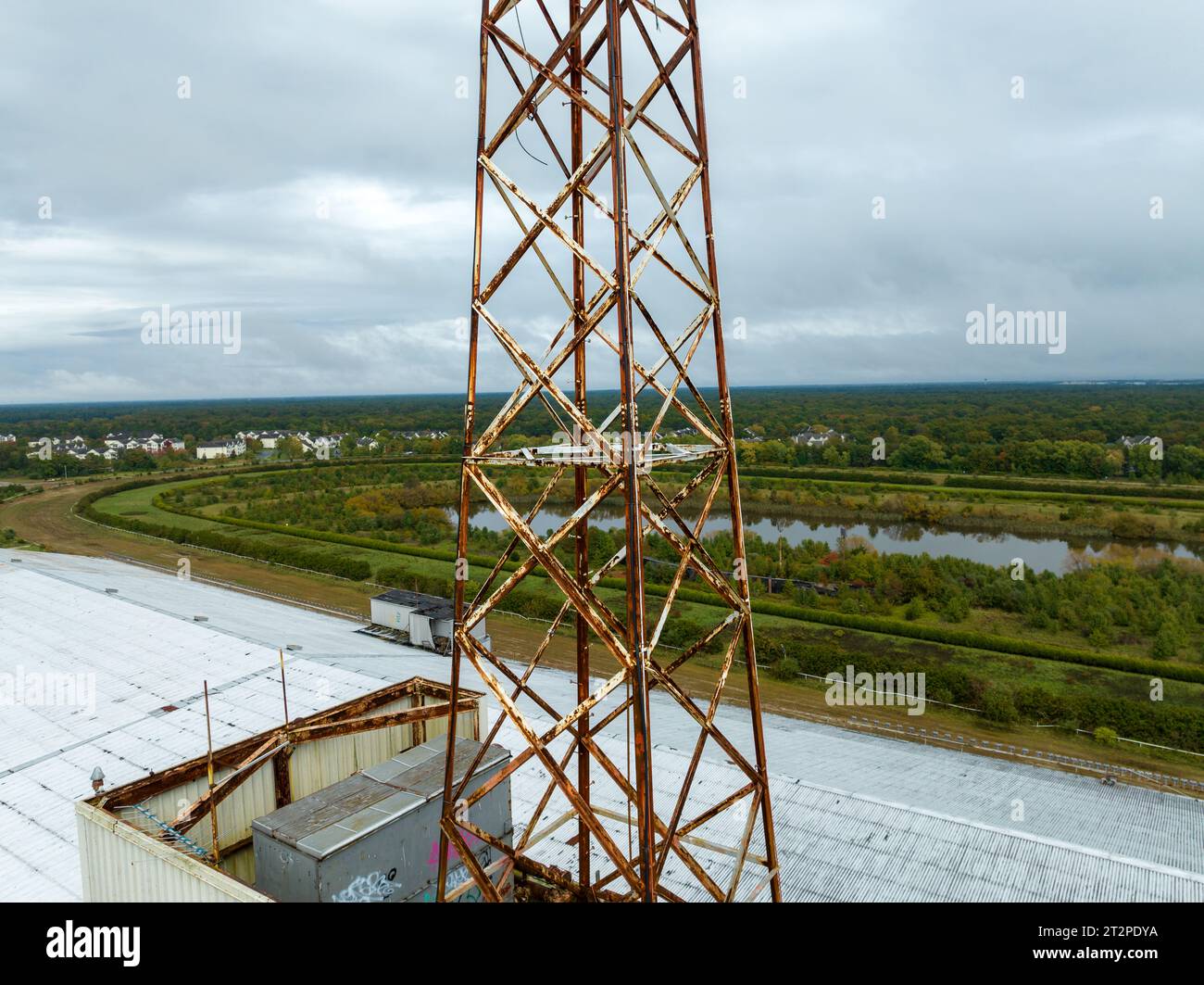 Old television and radio tower in faded colors with rusty structural ...