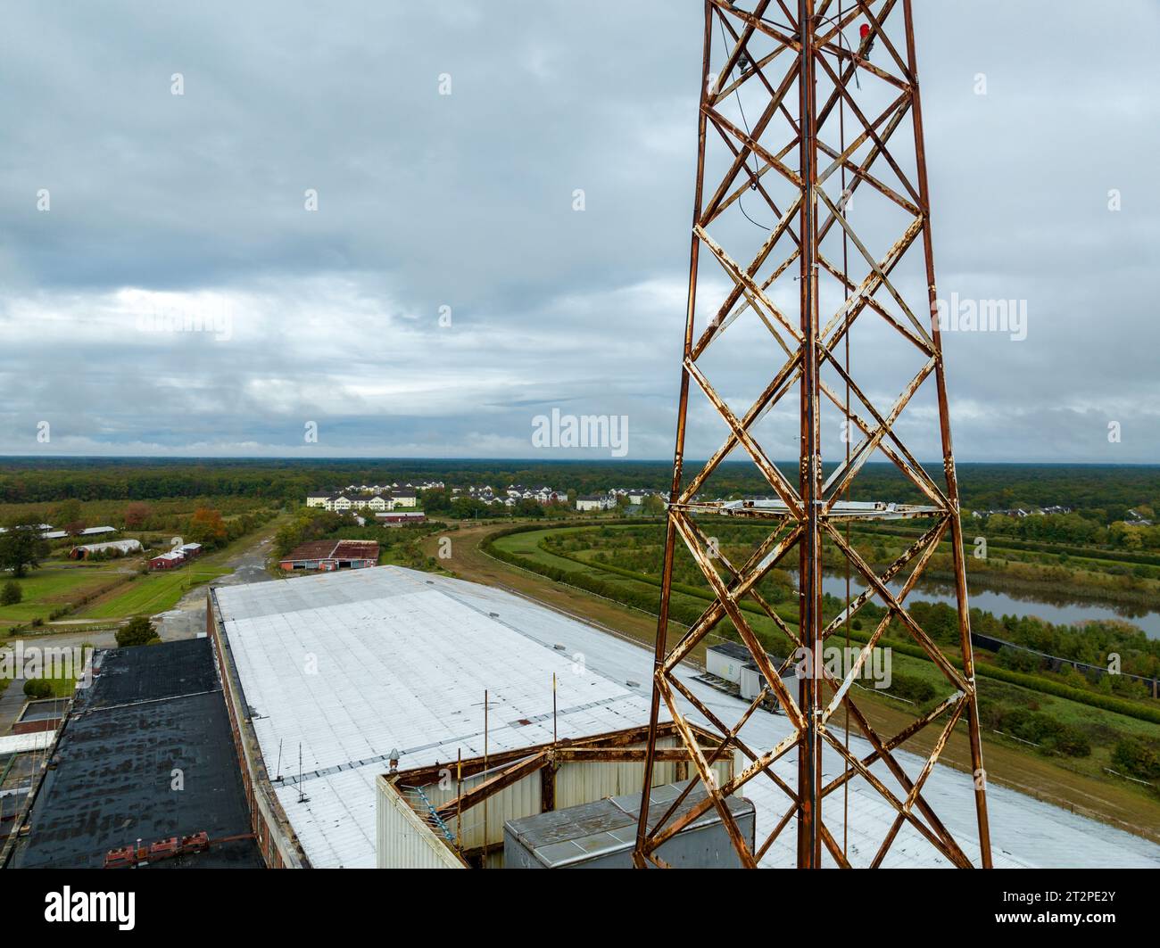 Old television and radio tower in faded colors with rusty structural ...