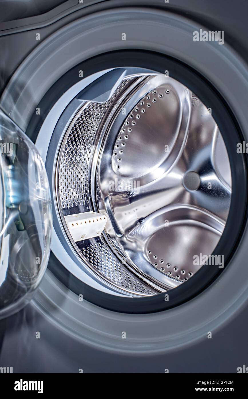 An empty drum (tank) of a washing machine of the front type Stock Photo ...