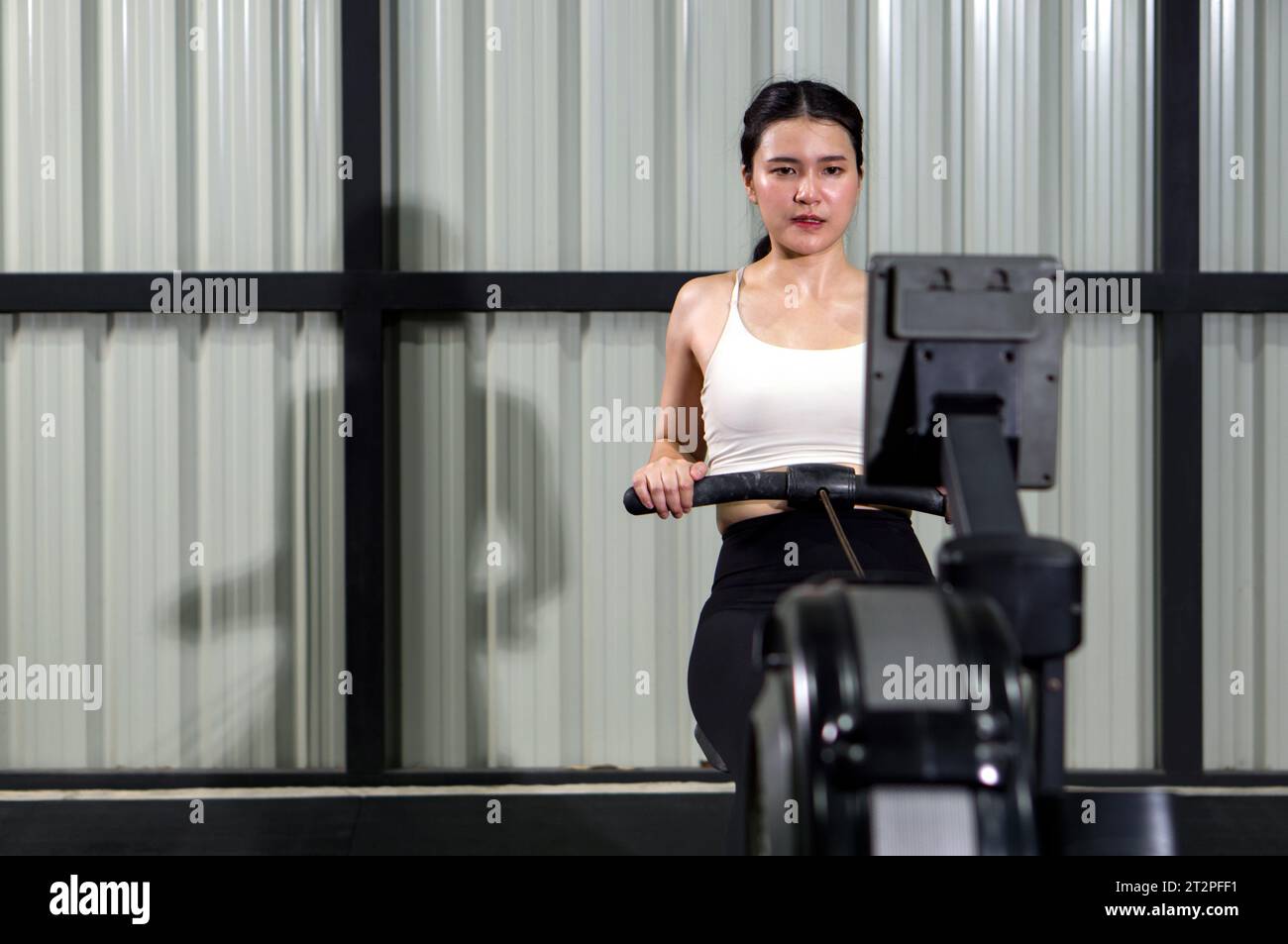 Health and active lifestyle concept. An athletic woman in sportswear is ...