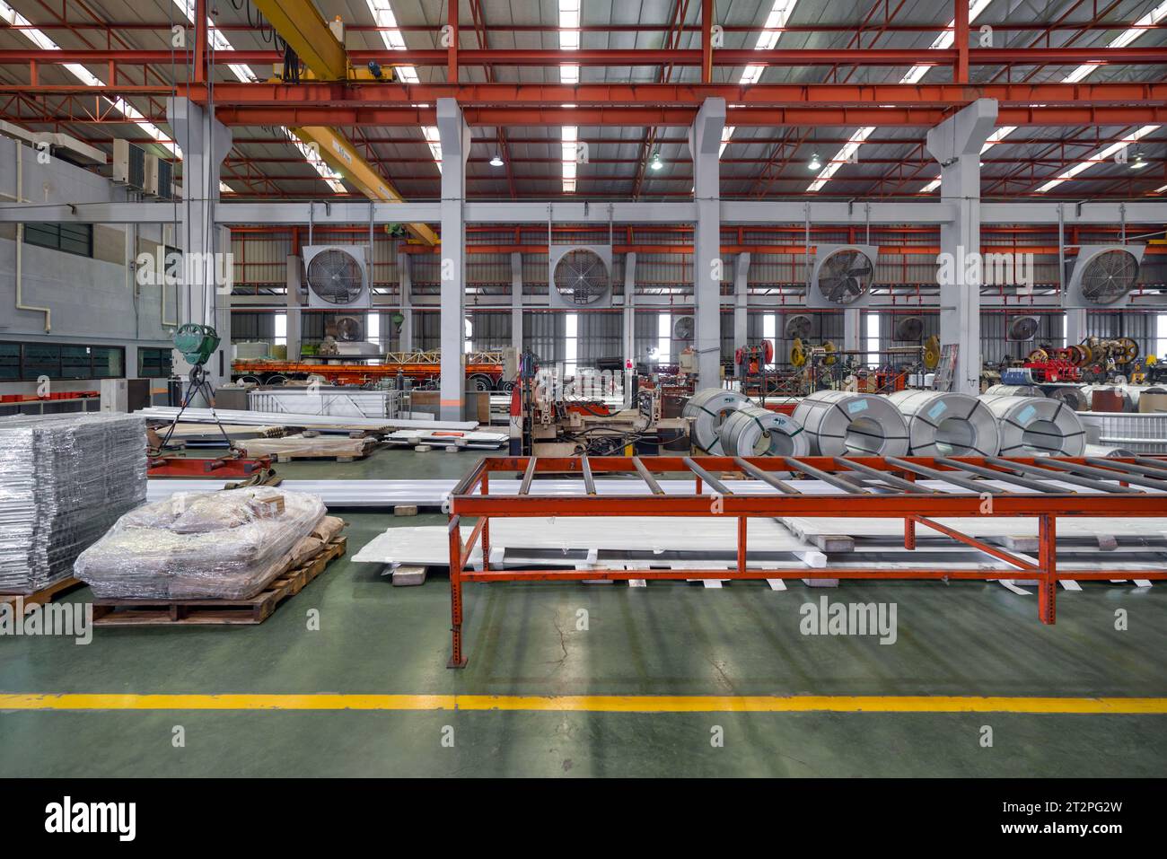 Metal sheets and steel sheet roll are placed on the floor in metal ...