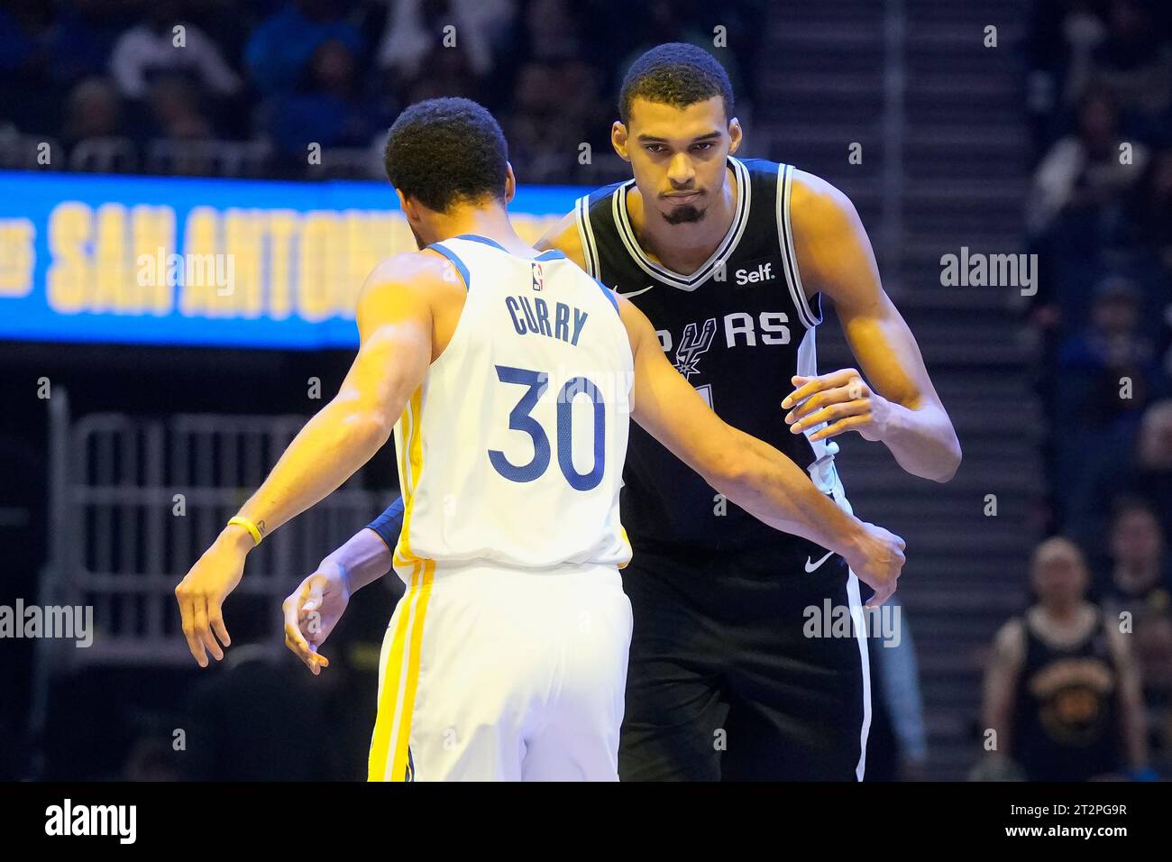 Golden State Warriors guard Stephen Curry (30) greets San Antonio Spurs center Victor Wembanyama ...