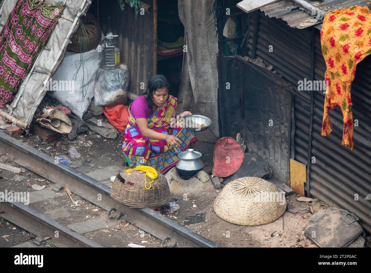 Life in the slums by the railway tracks in Tejgaon. Dhaka, Bangladesh ...