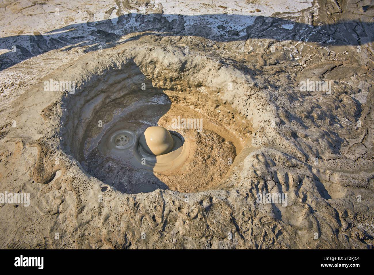 cones of mud volcanoes from which rivers of mud flow Stock Photo - Alamy