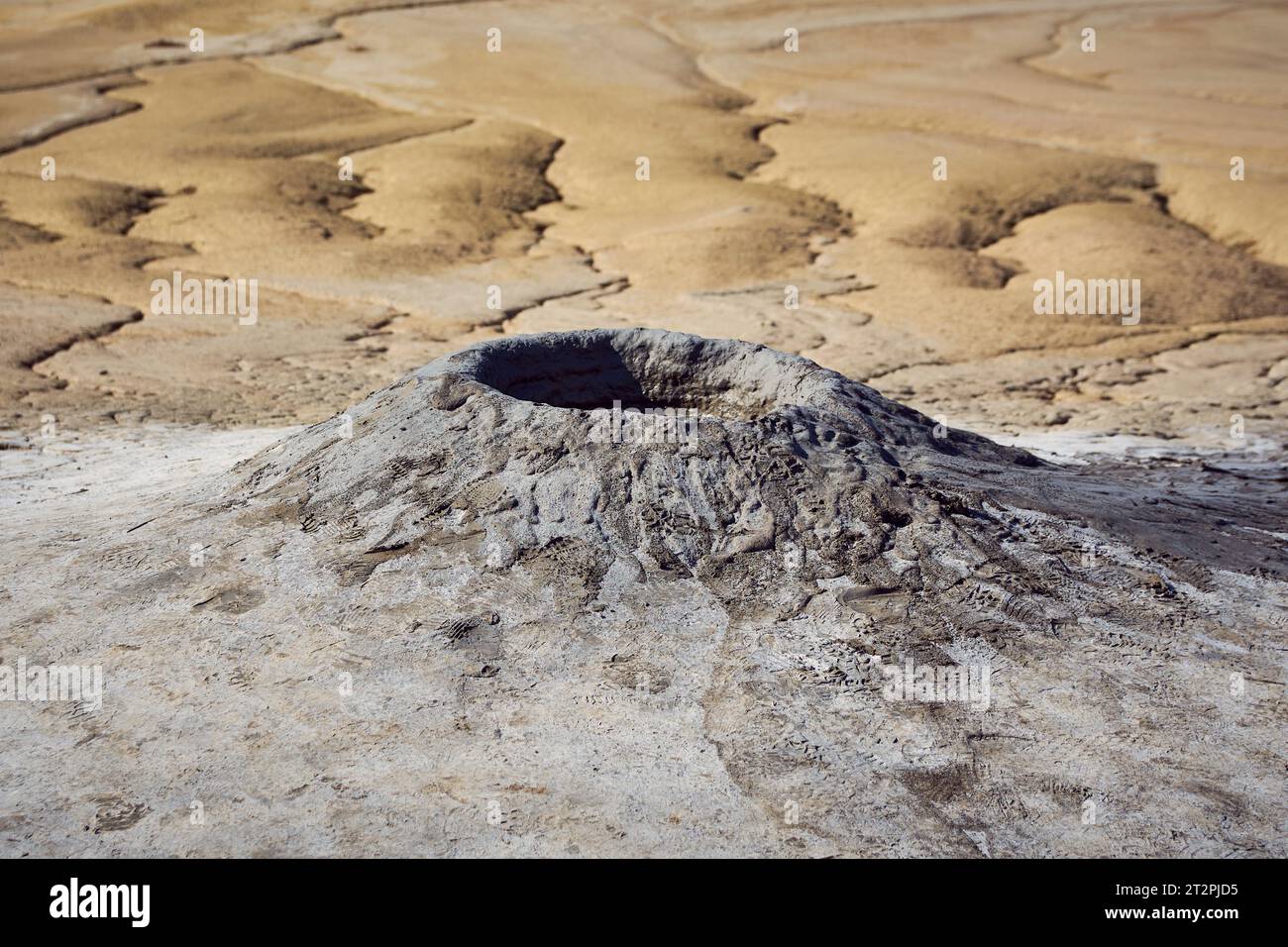 cones of mud volcanoes from which rivers of mud flow Stock Photo - Alamy