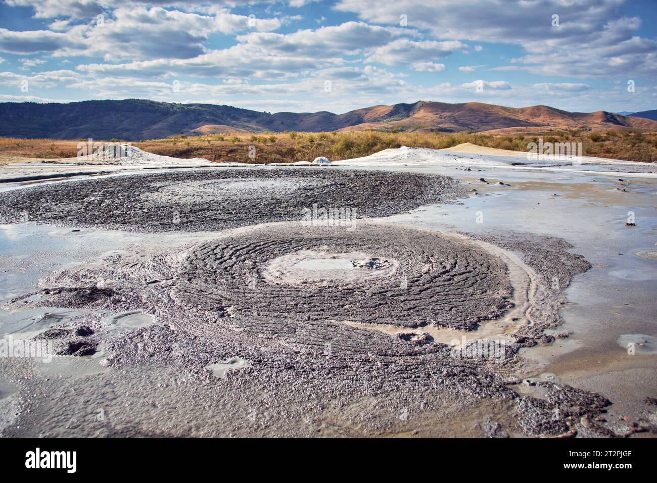 cones of mud volcanoes from which rivers of mud flow Stock Photo - Alamy