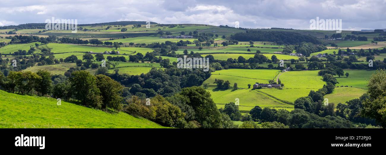 a panoramic view looking across pastures and farms on hill and dale in ...