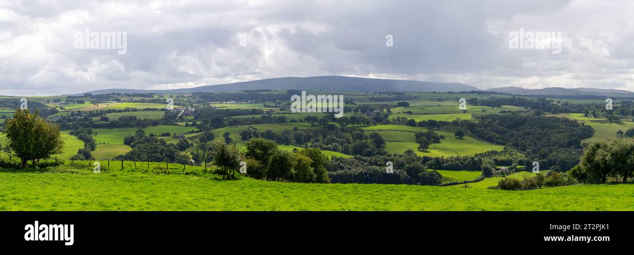 a panoramic view looking across pastures and farms on hill and dale in ...