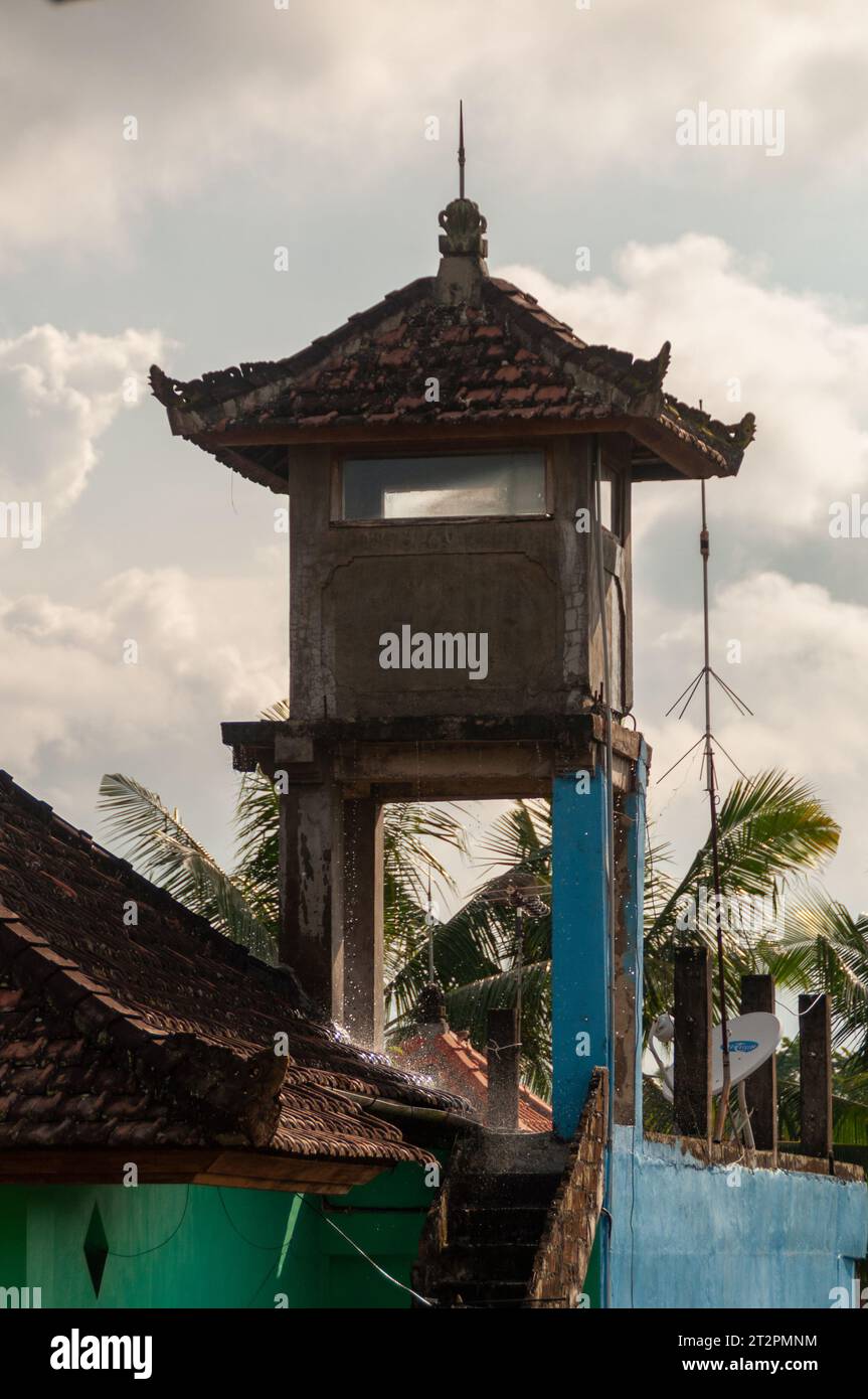 Water tower in Ubud, Bali with traditional design, cloudy skies in the ...