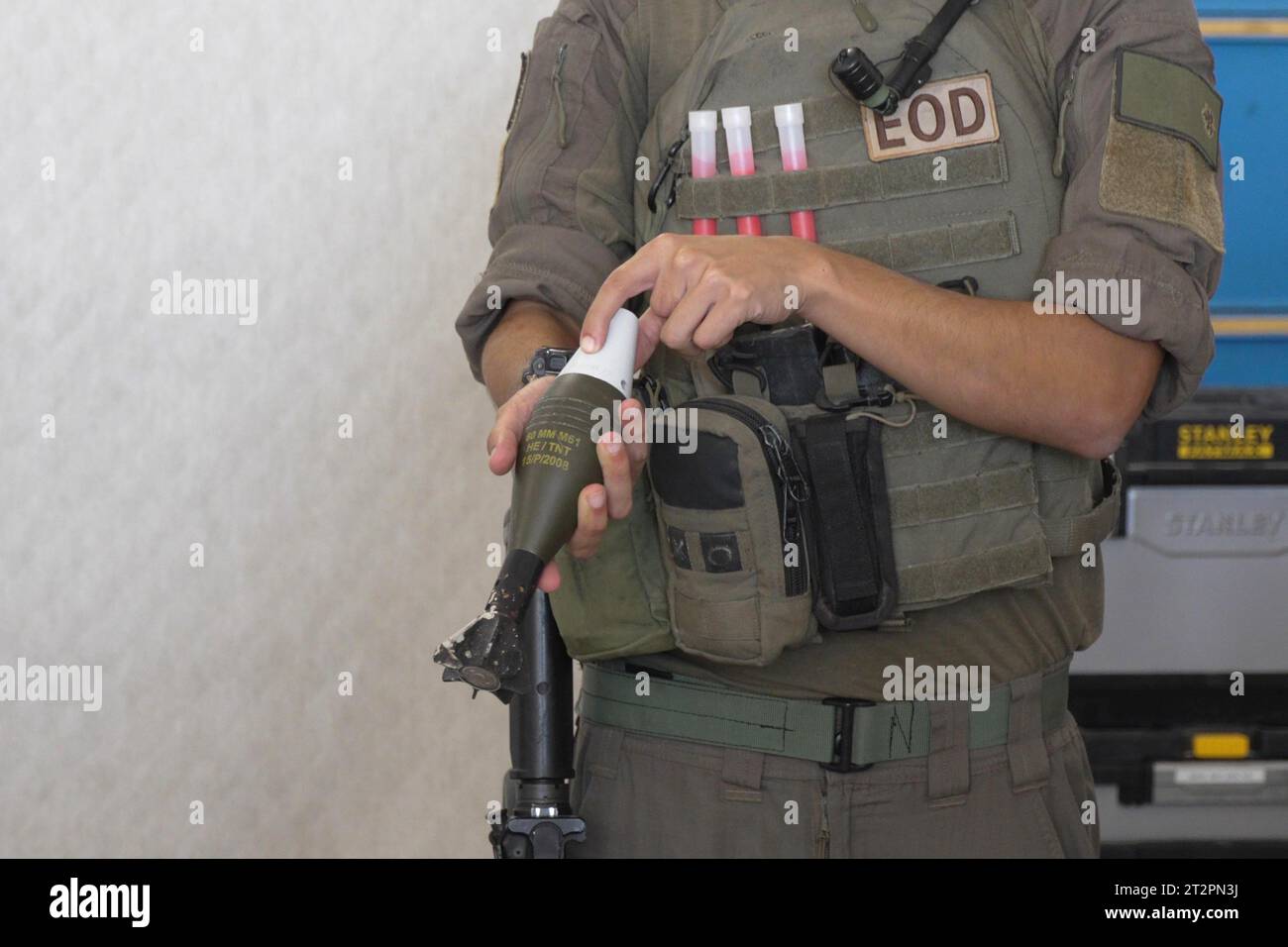 An Israeli soldier holds and describes an Iranian 60mm mortar during a ...