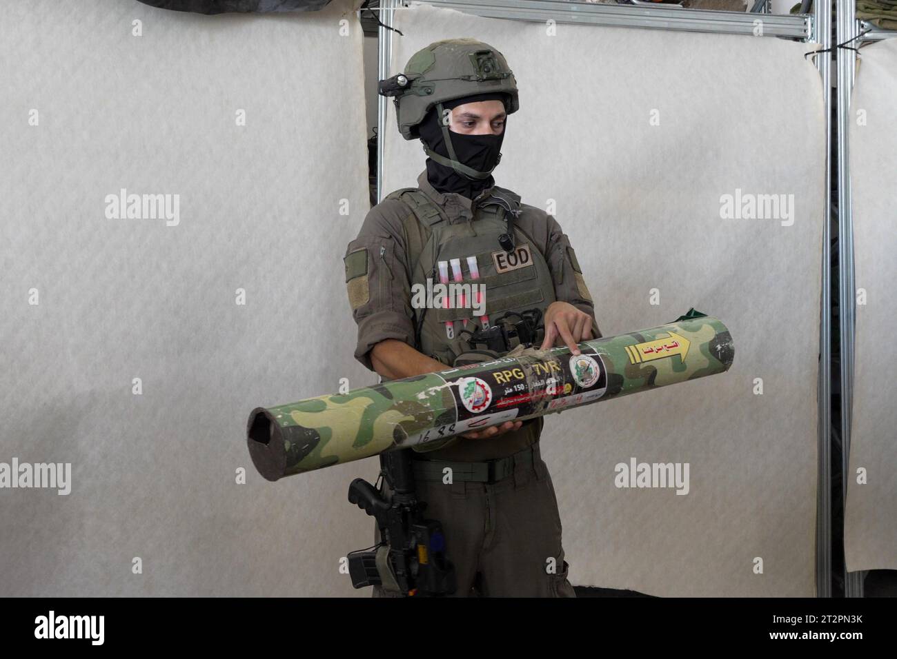 An Israeli soldier holds a Hamas made RPG during a presentation to the ...