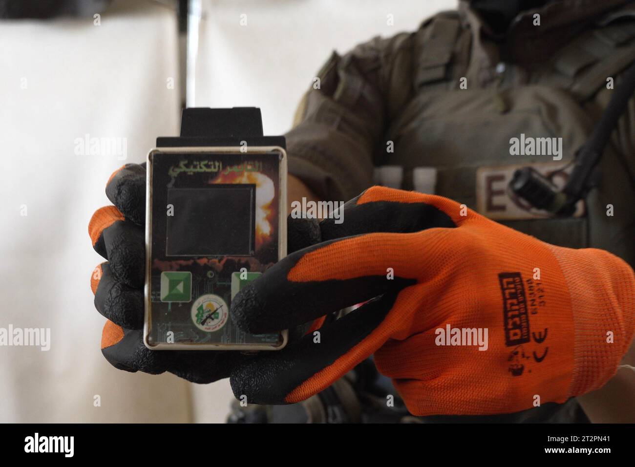 An Israeli soldier displays a timer of an explosive device that Hamas ...