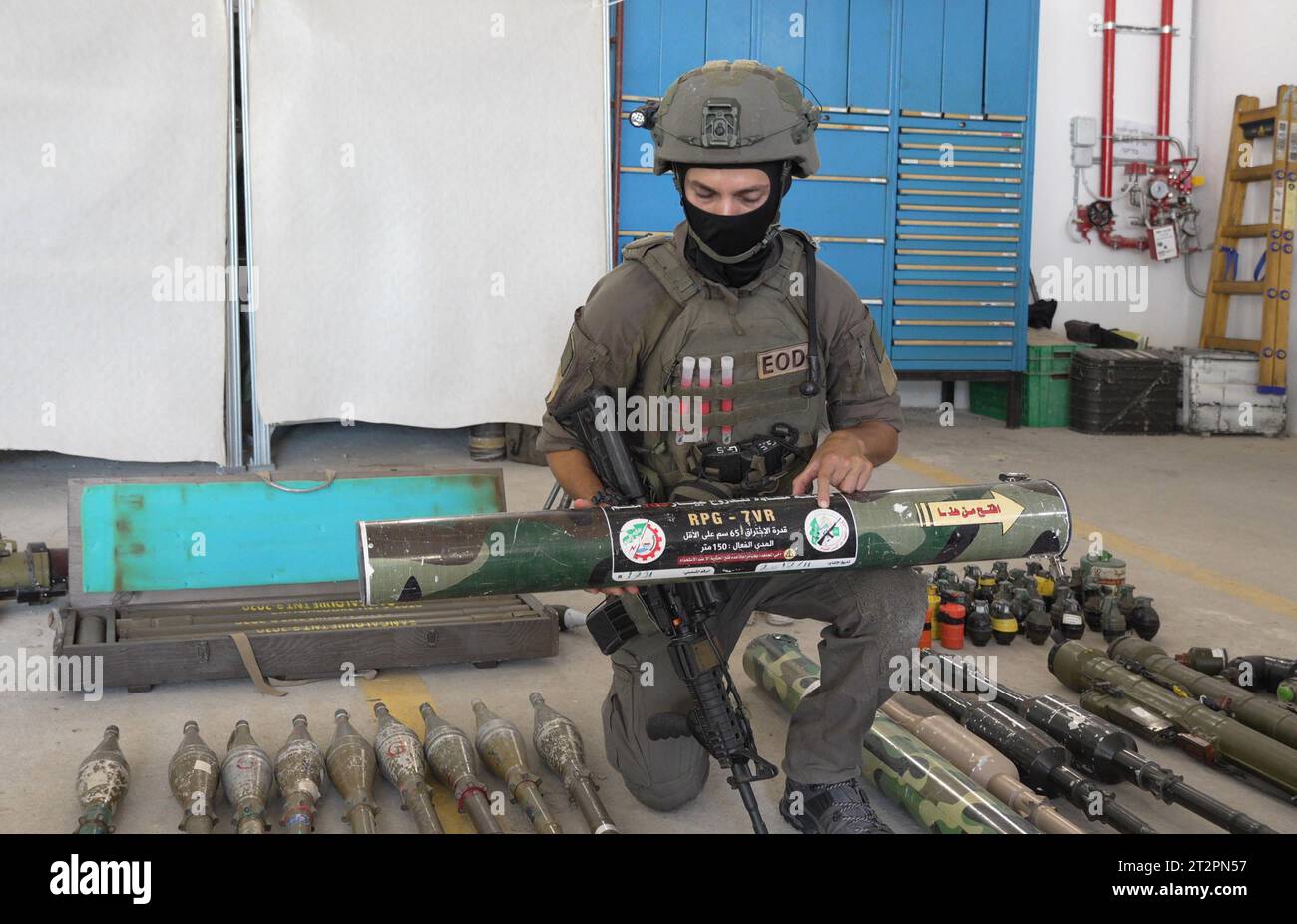 An Israeli soldier holds a Hamas made RPG during a presentation to the ...