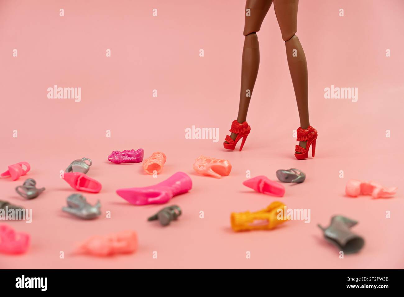Plastic doll legs in toy shoes and a lot of different stylish ...