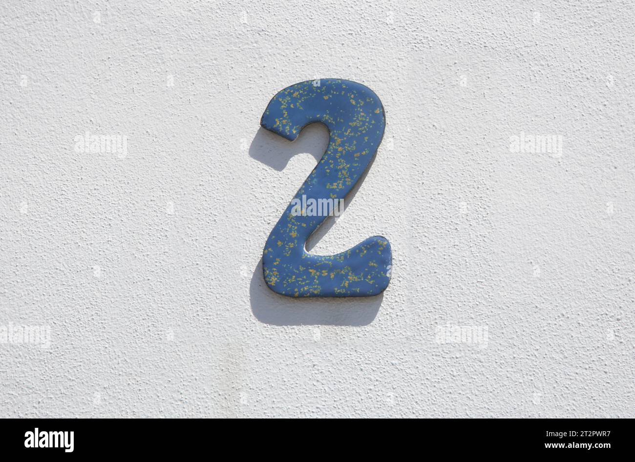 House number 2. Painted iron over whitewashed wall. Houses with ...