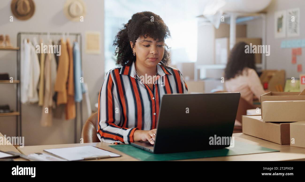 Boxes, typing and woman with a laptop, ecommerce and online reading ...