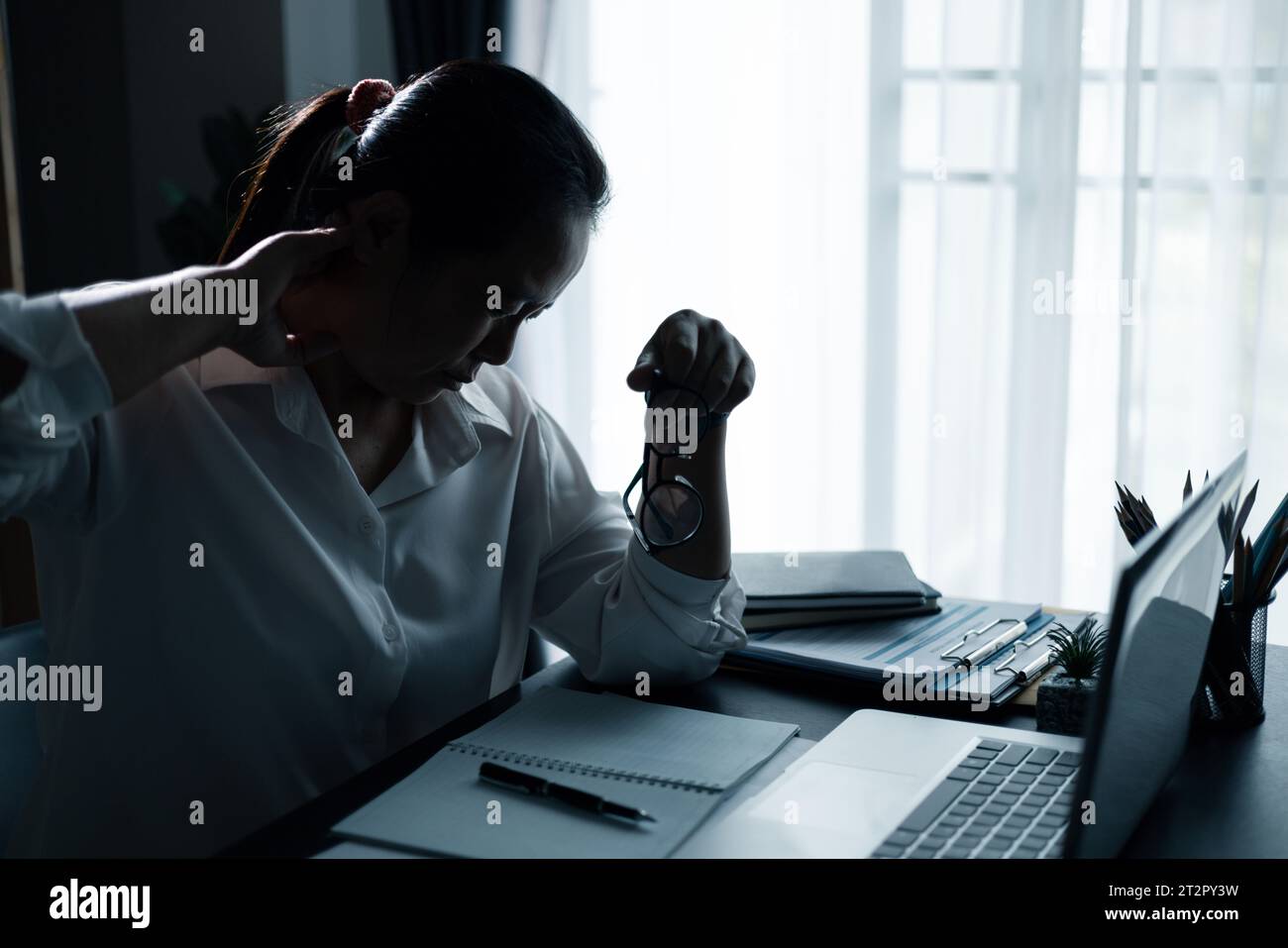 Hard think on analysis in the work. Young asian business woman is ...