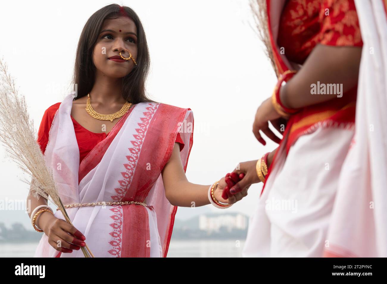 October 19, 2023: Young girls wearing traditional clothing pose for ...
